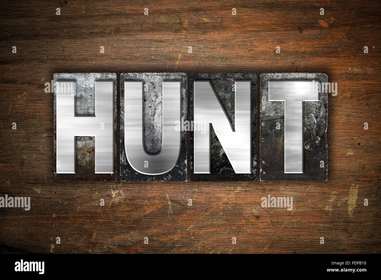 The word "Hunt" written in vintage metal letterpress type on an aged ...