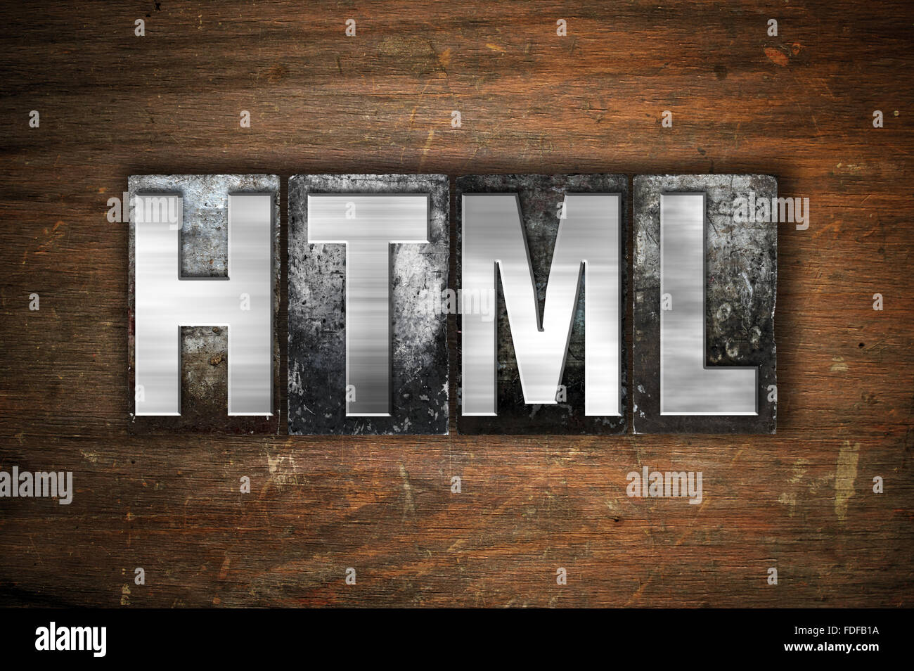 The word "HTML" written in vintage metal letterpress type on an aged ...