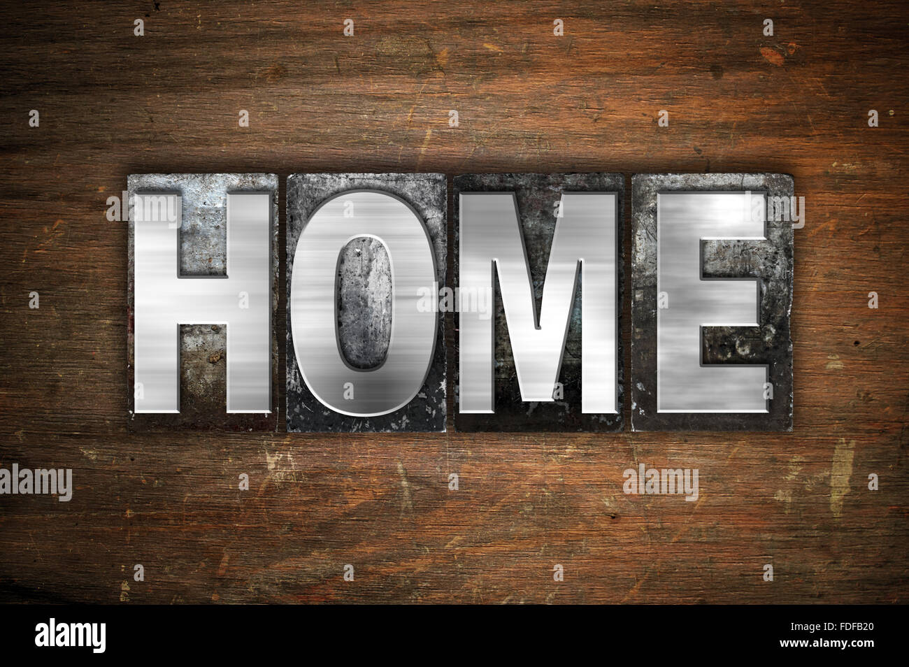 The word "Home" written in vintage metal letterpress type on an aged ...