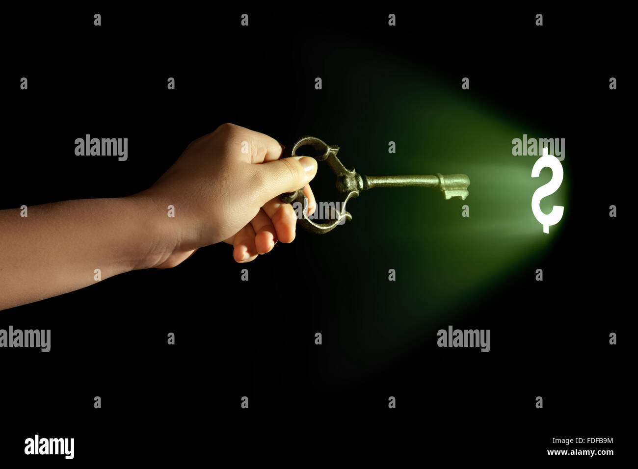 Close-up of human hand holding key. Money concept Stock Photo - Alamy