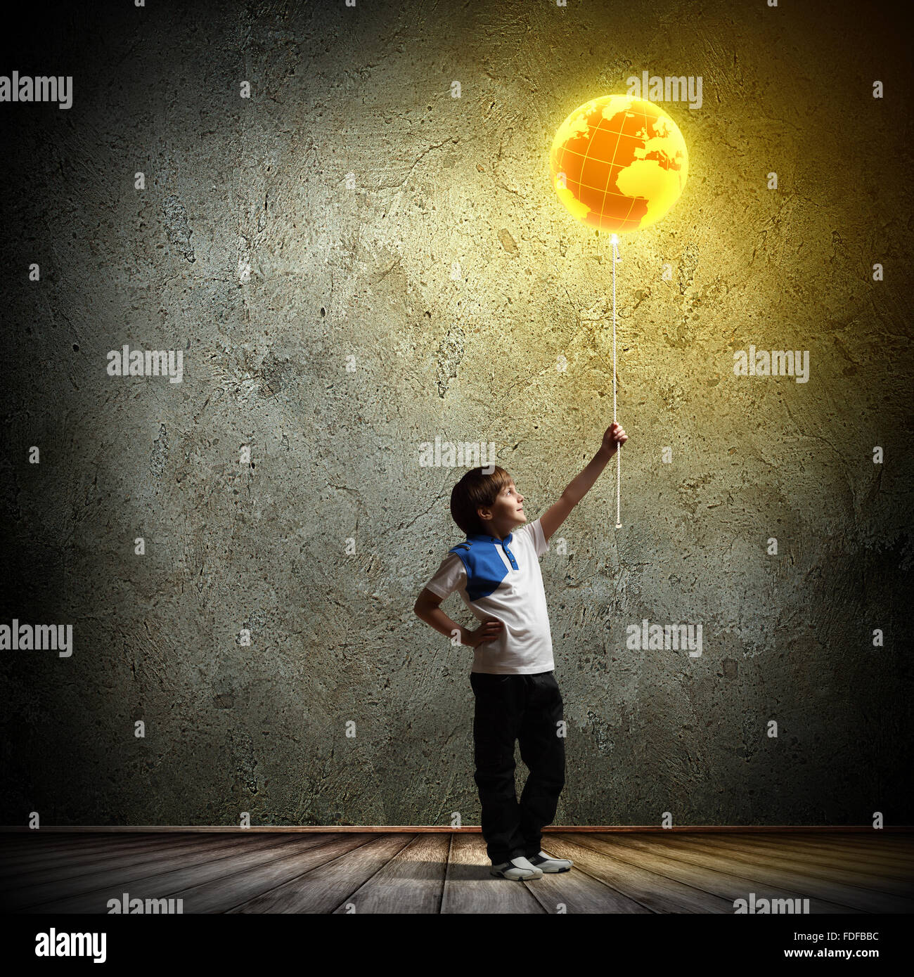 Image of little cute boy with globe balloon Stock Photo - Alamy