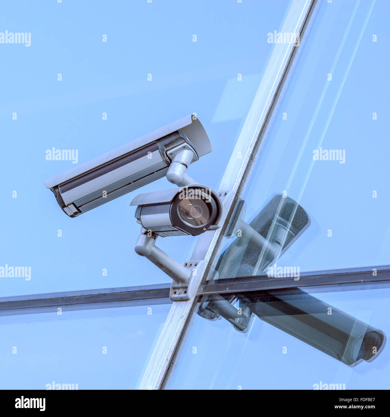 Security cameras hanging on the wall of the office building Stock Photo ...