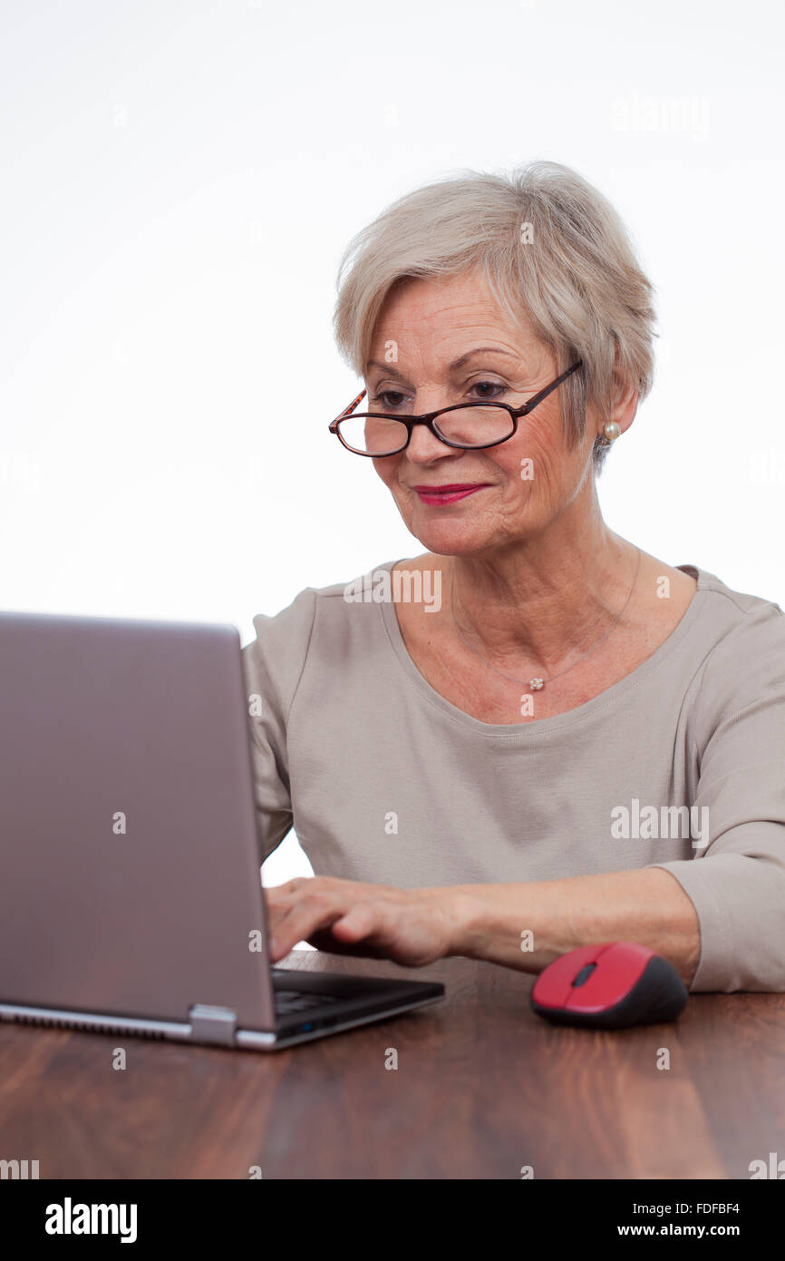 old senior woman surfing internet using laptop Stock Photo - Alamy