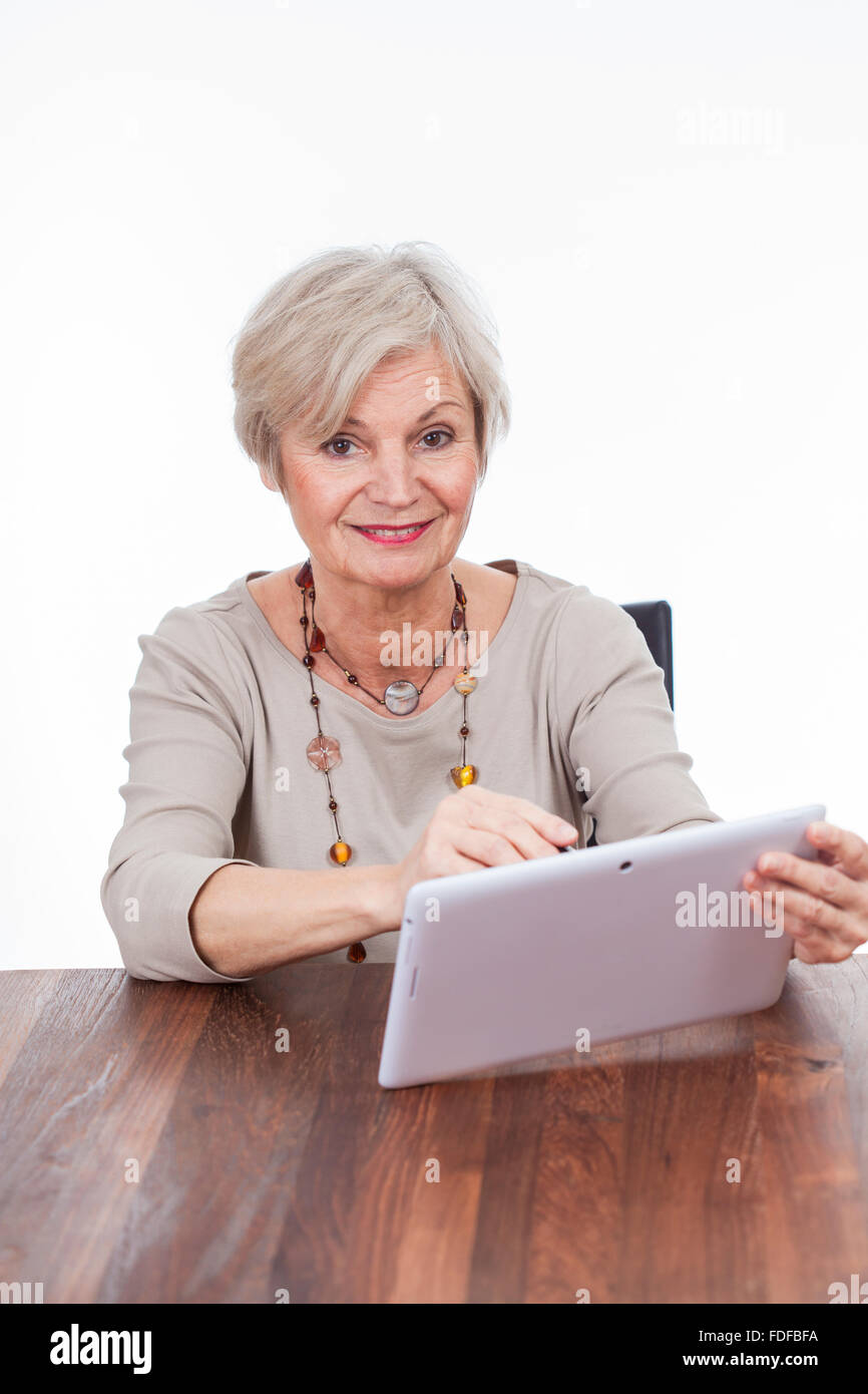 old senior woman using tablet for surfing internet Stock Photo - Alamy