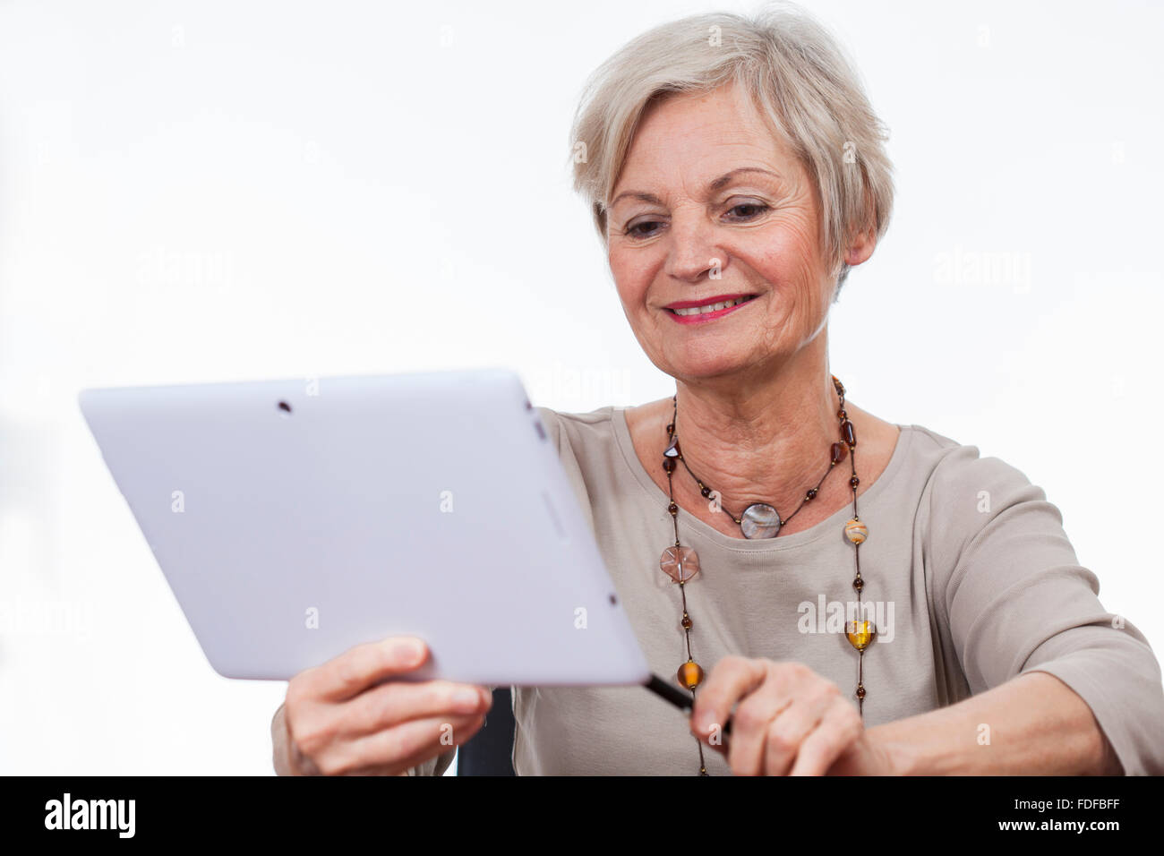 Old lady tablet hi-res stock photography and images - Alamy