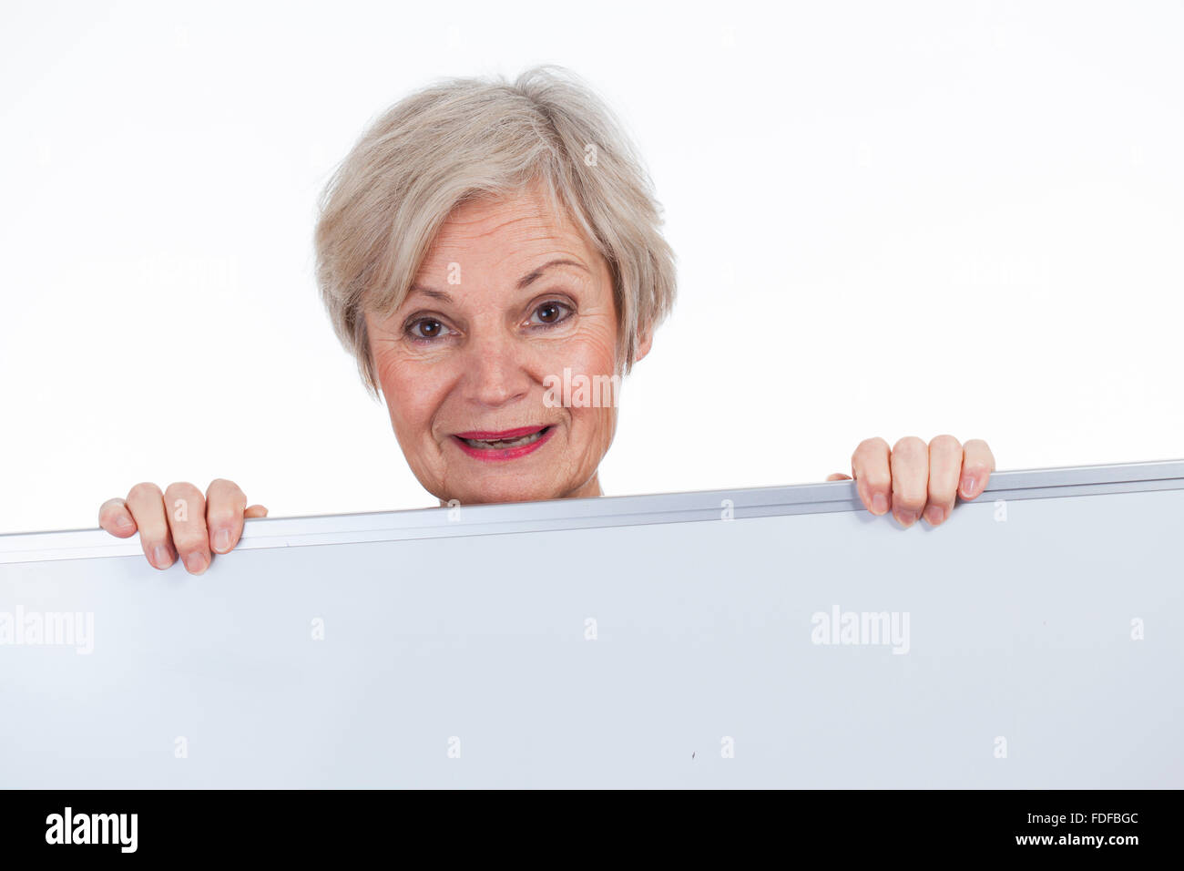 confident senior older women smiling with ad sign in hands text space ...