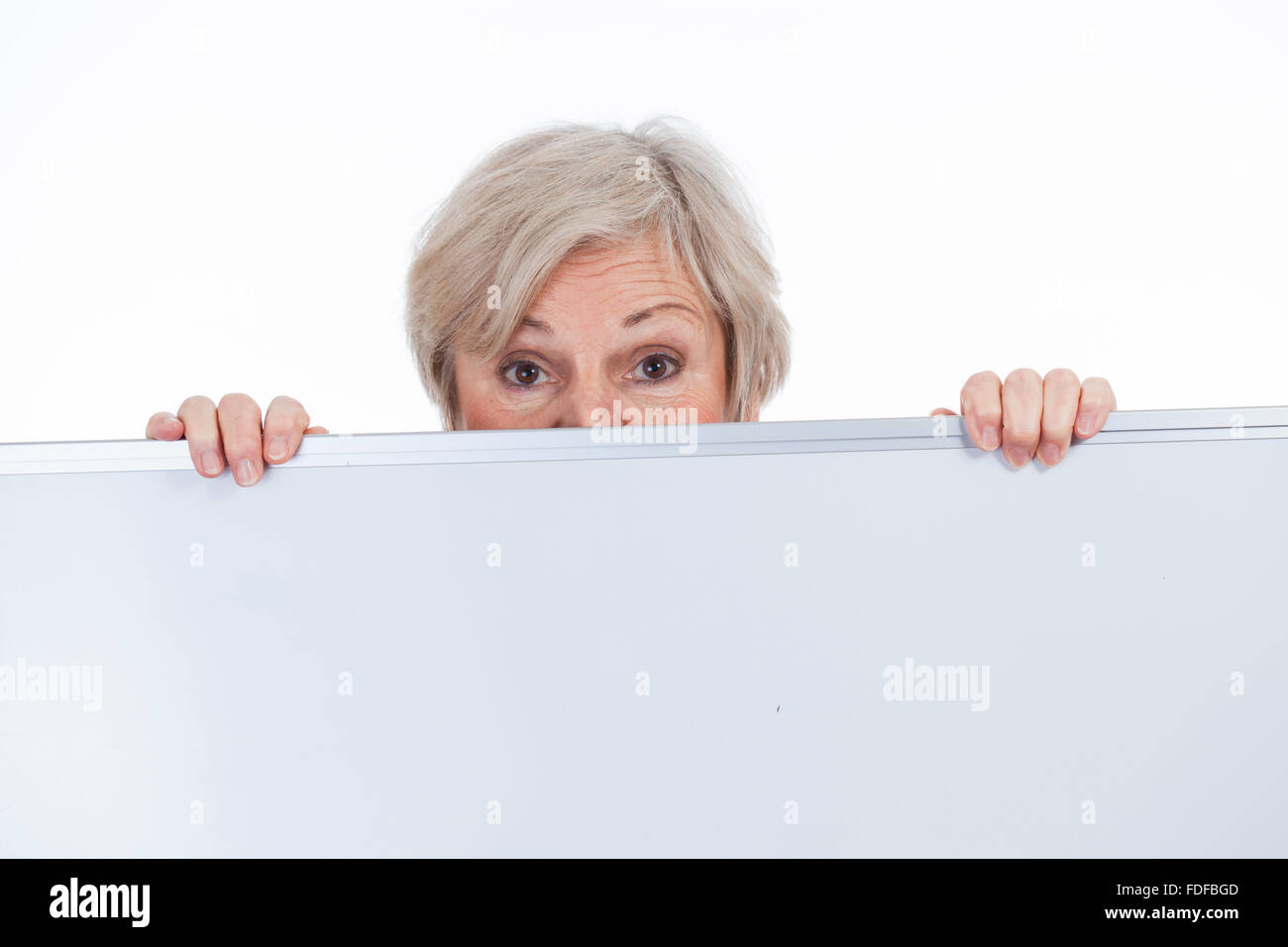 beautiful happy smiling older senior women holding sign with text space ...