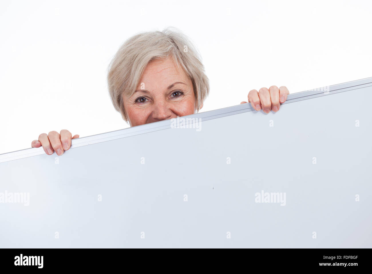 beautiful happy smiling older senior women holding sign with text space ...