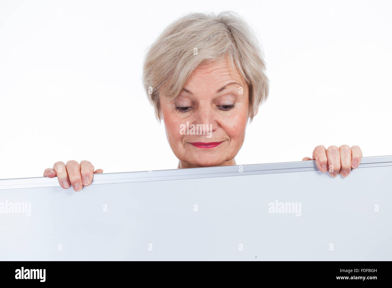 beautiful happy smiling older senior women holding sign with text space ...