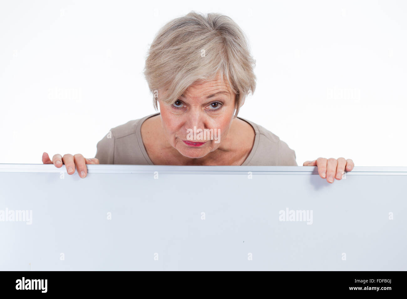 beautiful happy smiling older senior women holding sign with text space ...