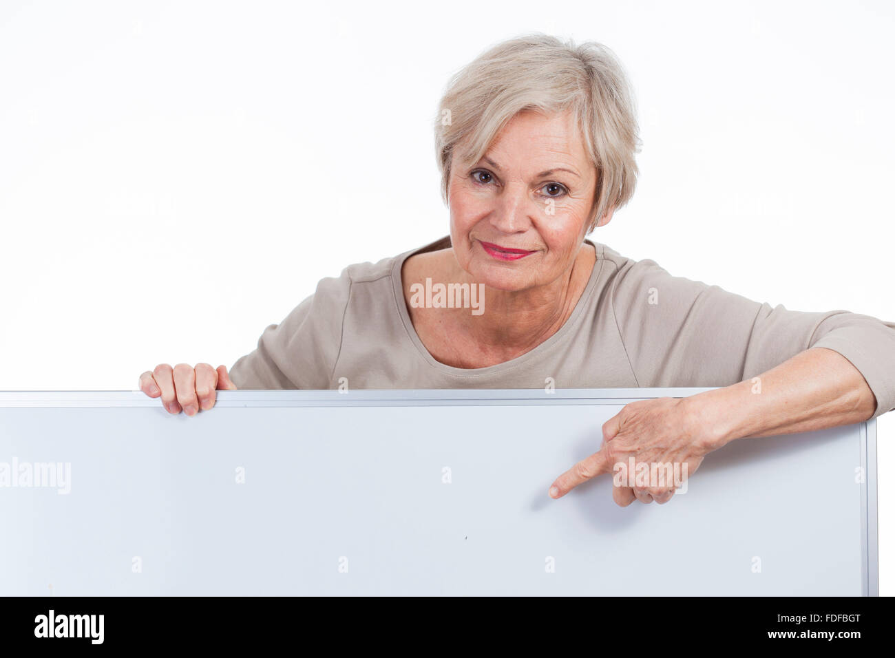 beautiful happy smiling older senior women holding sign with text space ...