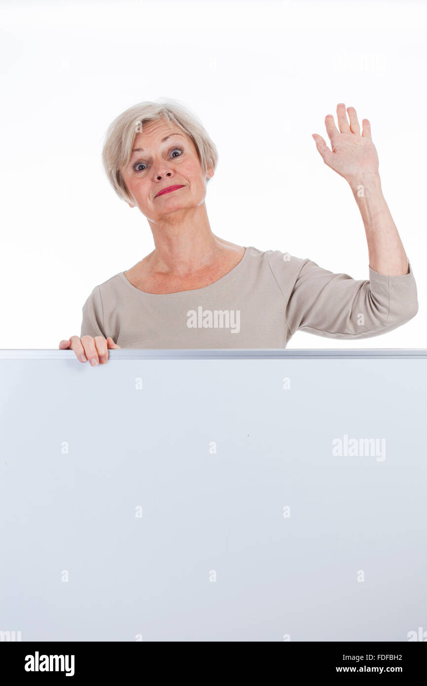 beautiful happy smiling older senior women holding sign with text space ...