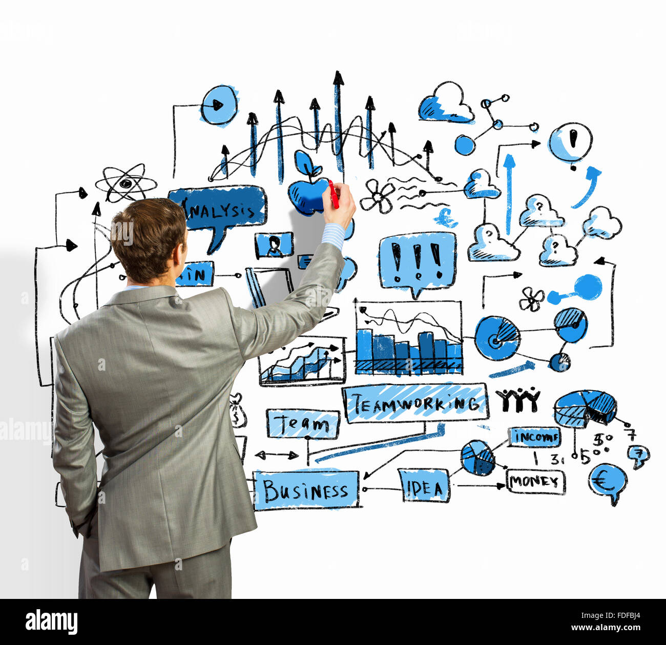Back view image of businessman drawing sketches on wall Stock Photo - Alamy