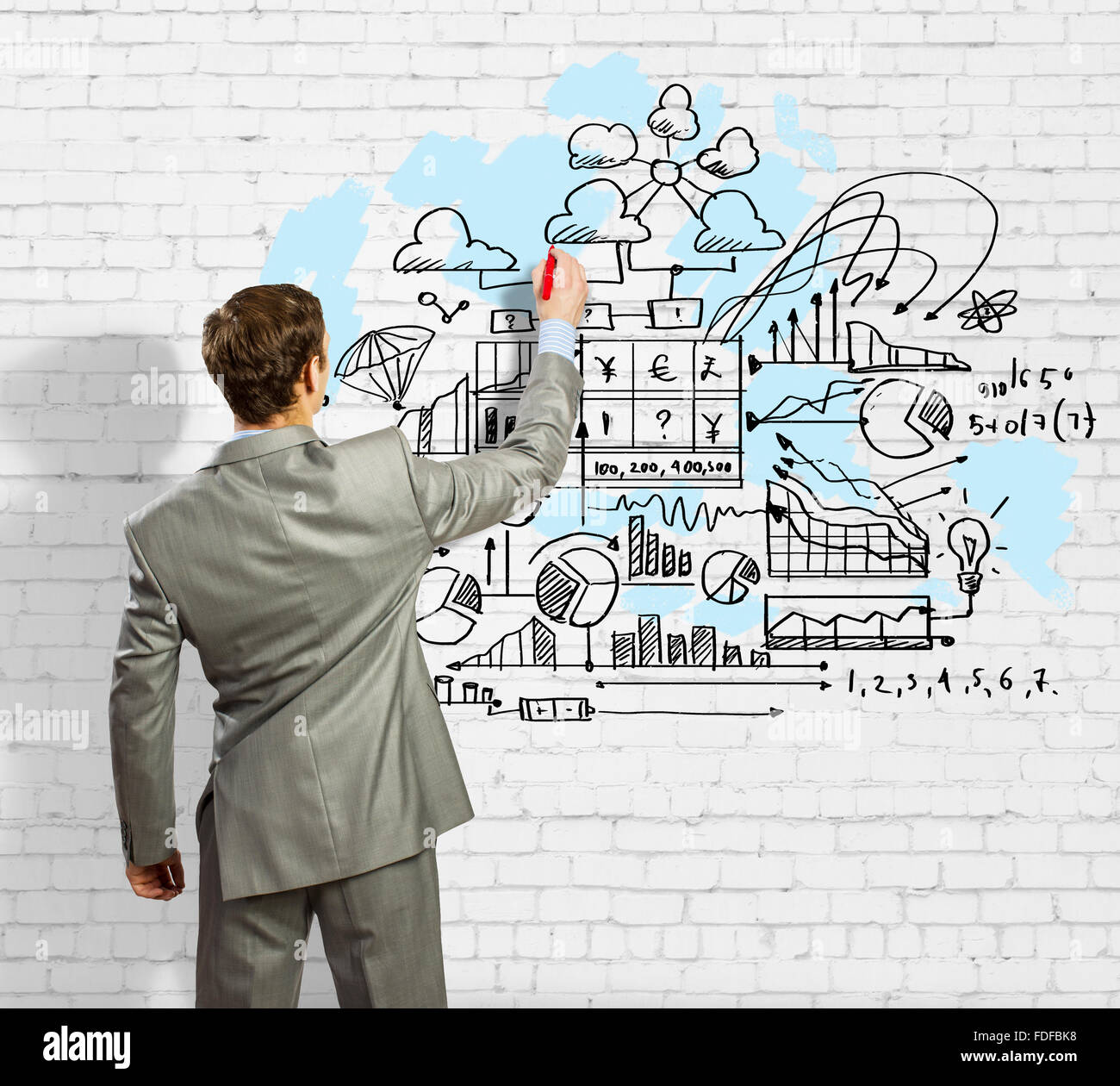 Back view image of businessman drawing sketches on wall Stock Photo - Alamy