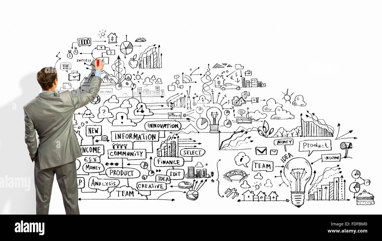 Back view image of businessman drawing sketches on wall Stock Photo - Alamy