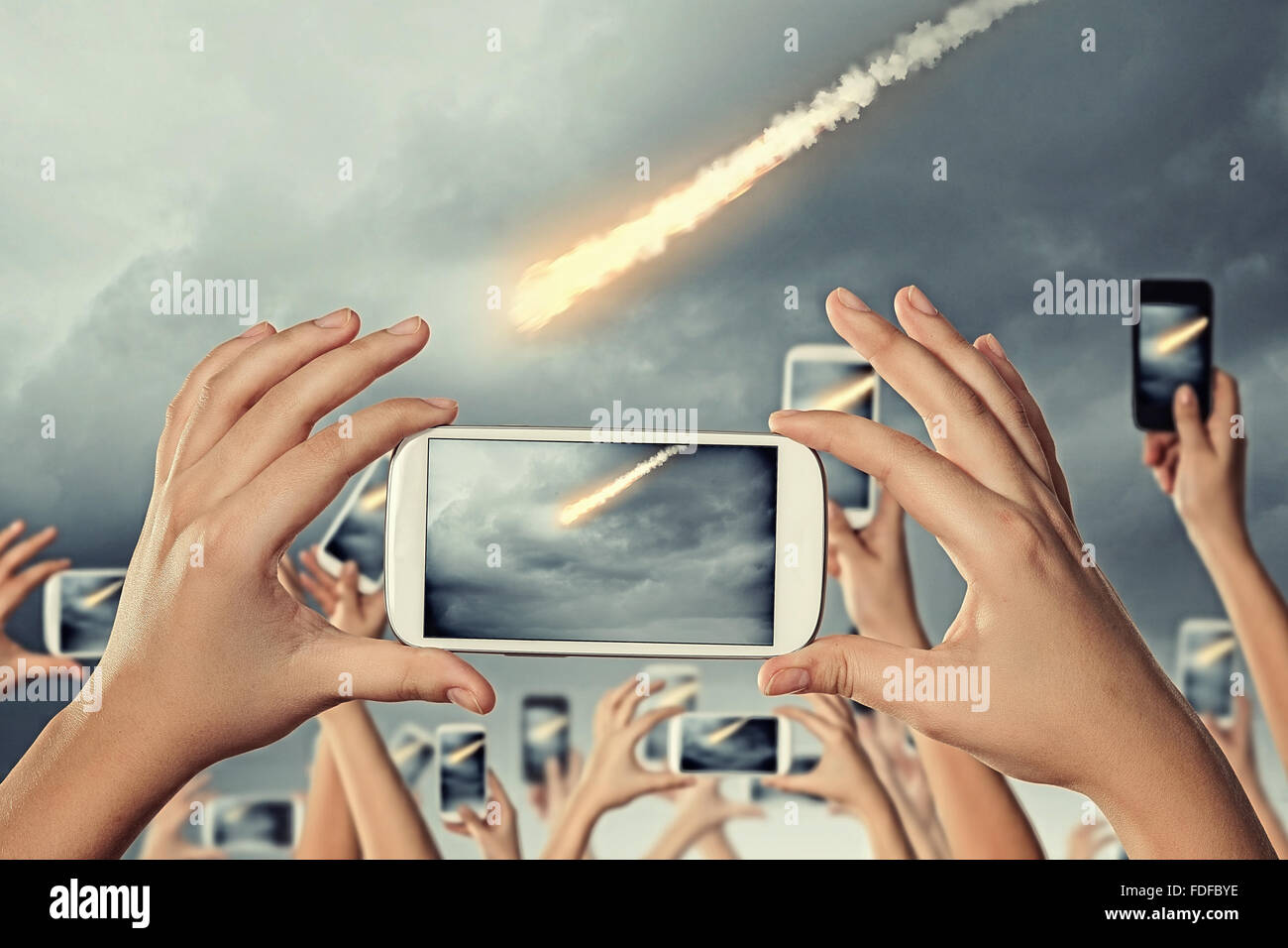 Close up of human hands taking photo of falling meteorite Stock Photo ...