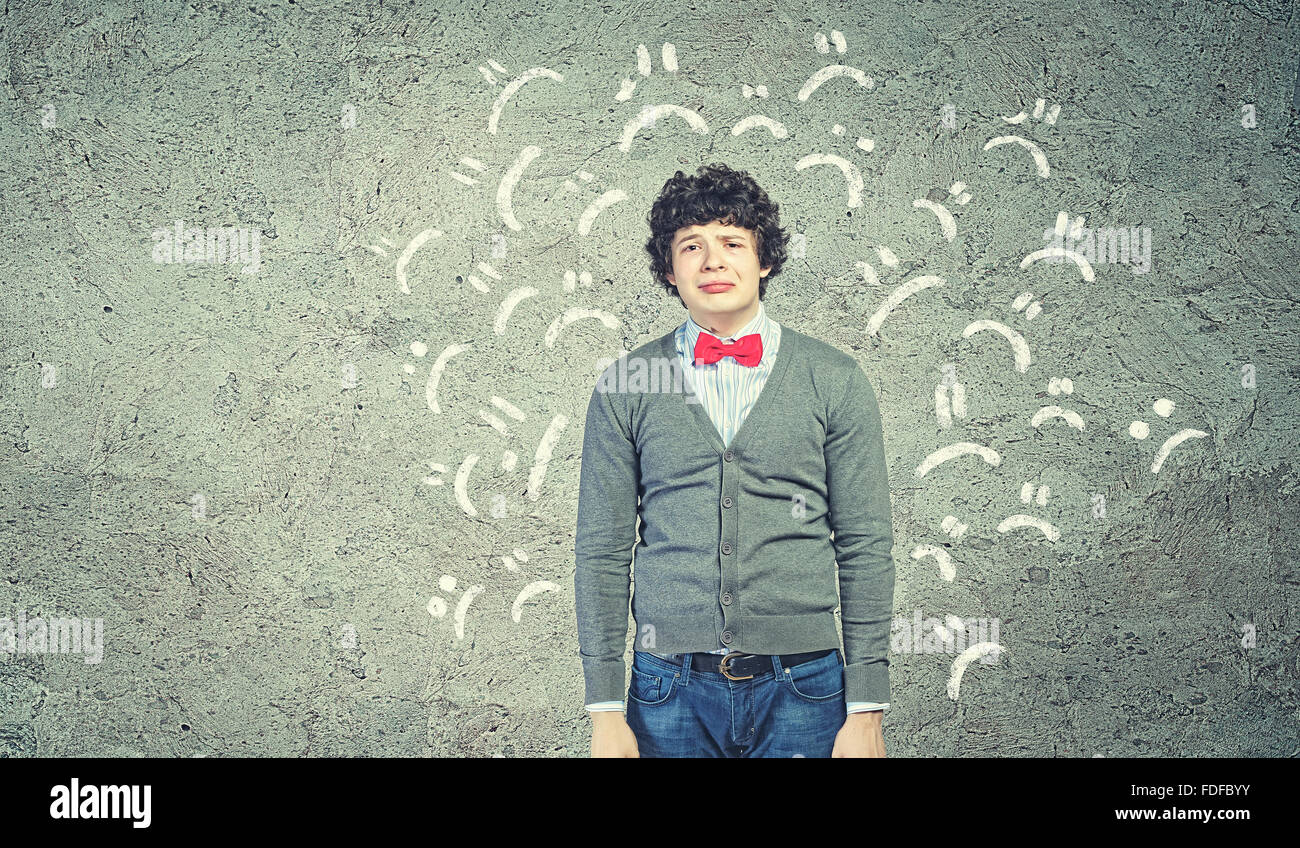 Image of young upset man in red tie crying Stock Photo - Alamy