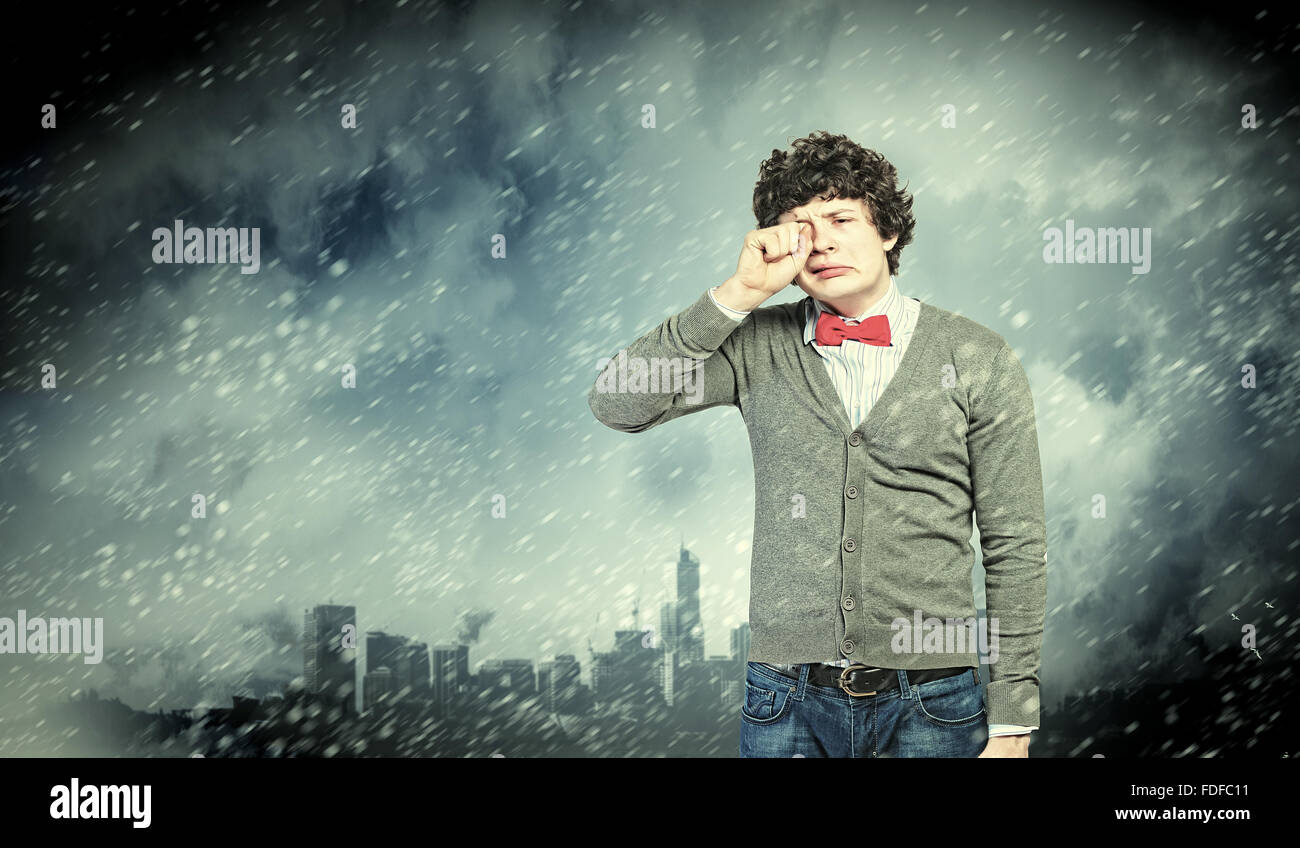 Image of young upset man in red tie crying Stock Photo - Alamy