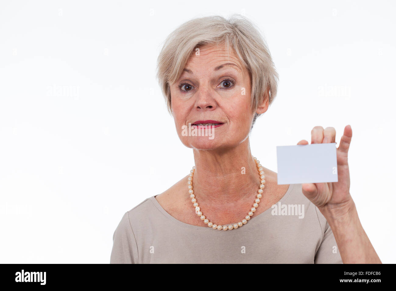 beautiful happy smiling older senior women holding sign with text space ...