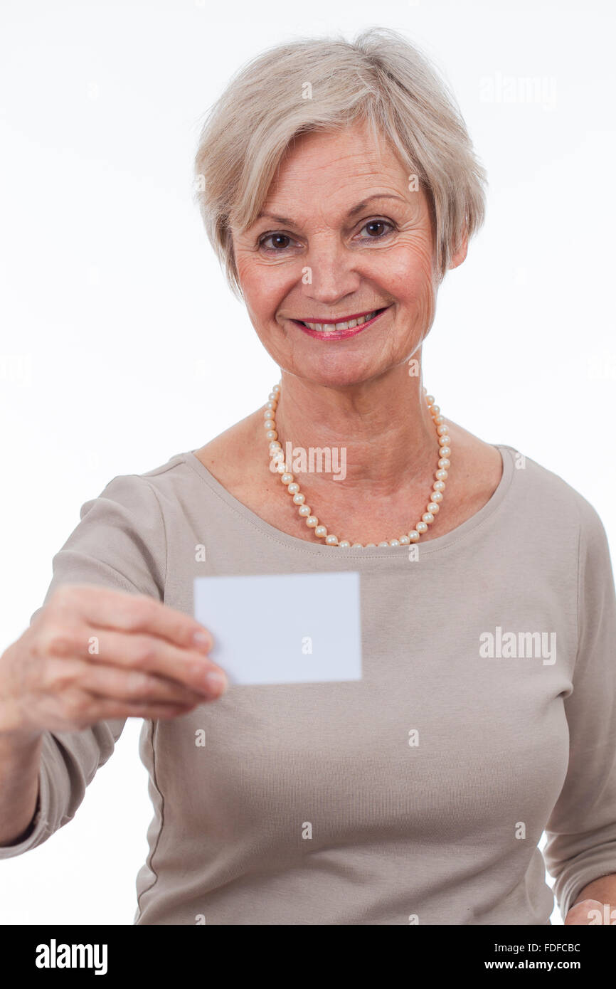 beautiful happy smiling older senior women holding sign with text space ...