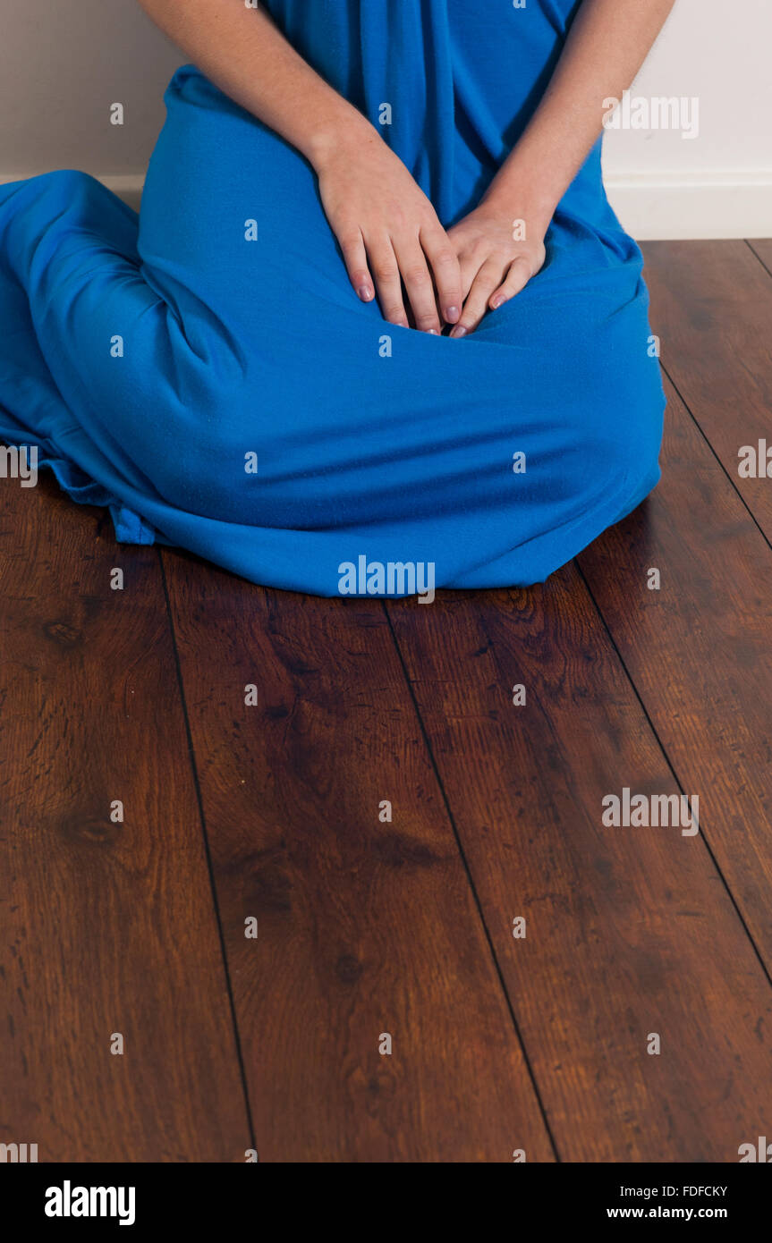 Depressed woman sat on floor hi-res stock photography and images - Alamy