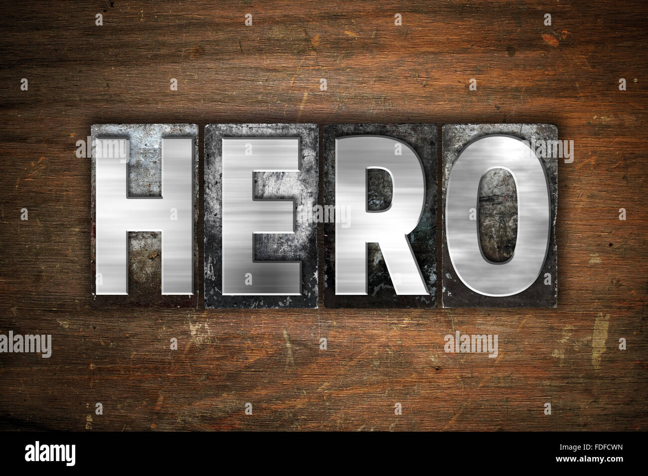 The word "Hero" written in vintage metal letterpress type on an aged ...
