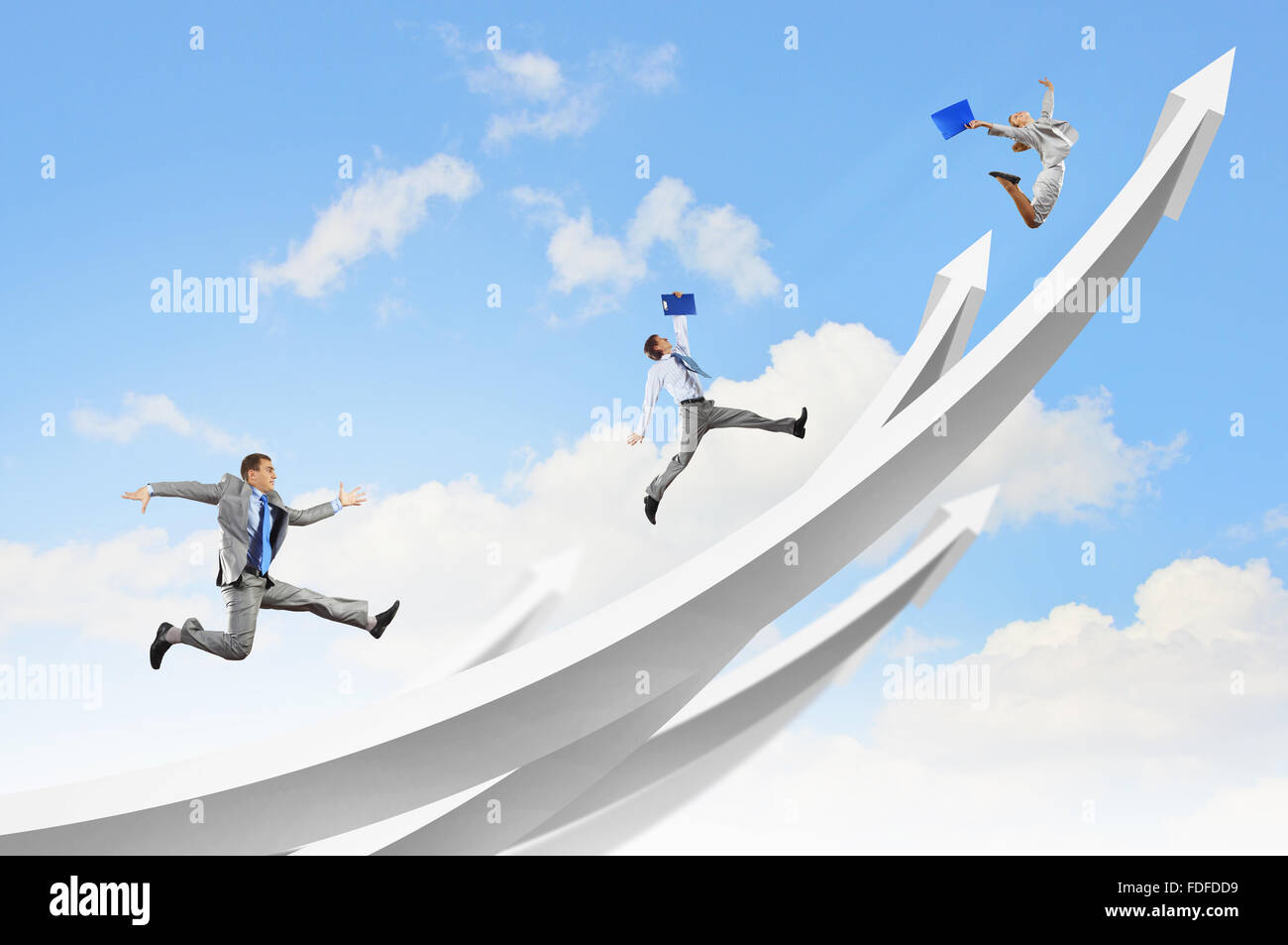 Young businesspeople jumping on white arrows. Growth concept Stock ...