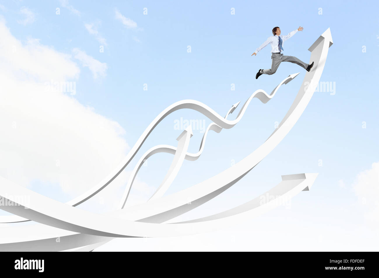 Young businessman jumping on white arrows. Growth concept Stock Photo ...