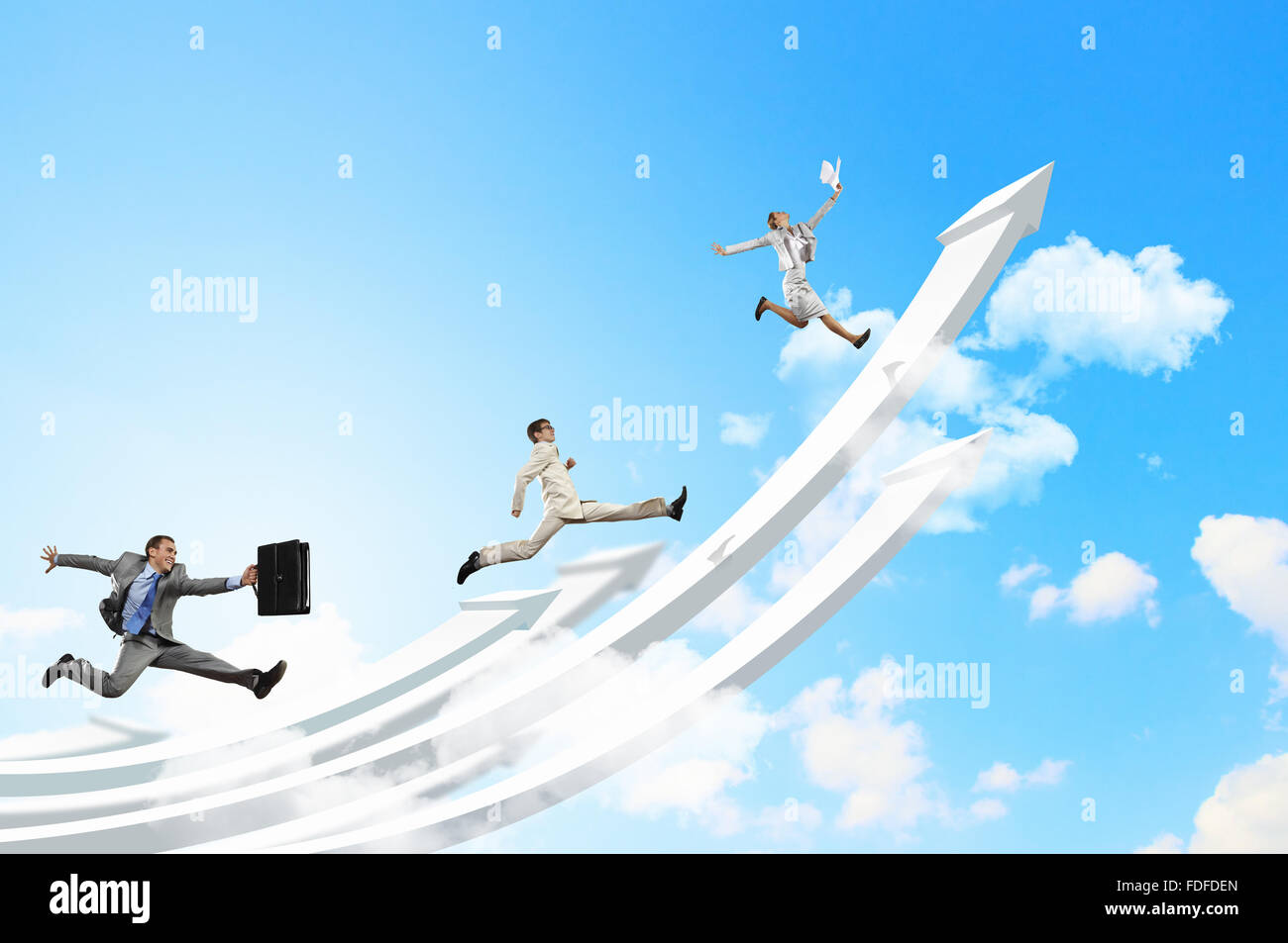 Young businesspeople jumping on white arrows. Growth concept Stock ...