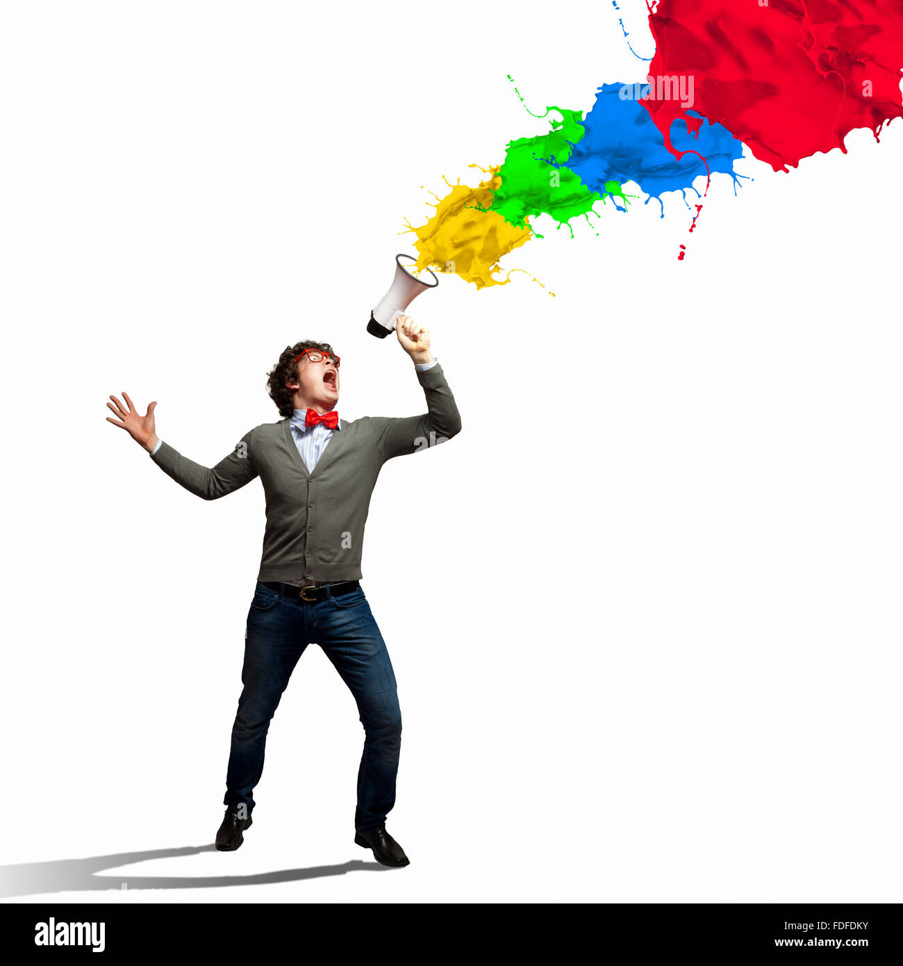 Portrait of young man shouting loudly using megaphone Stock Photo - Alamy