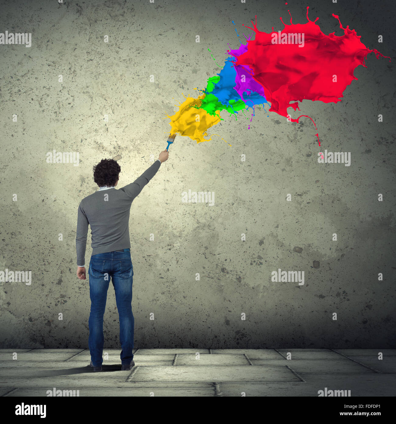 Young man with a splash coloured like a rainbow Stock Photo - Alamy