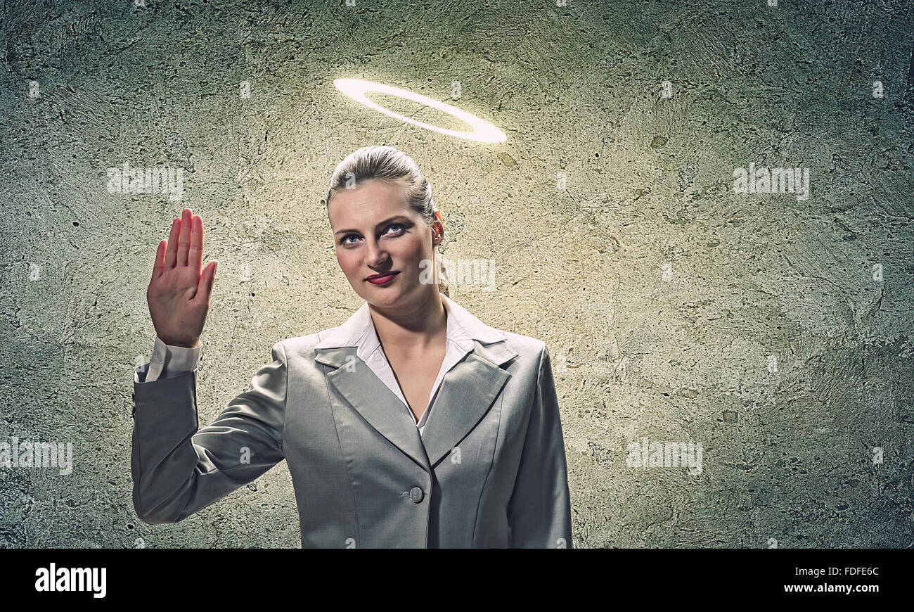 Image of businesswoman with halo above head Stock Photo - Alamy