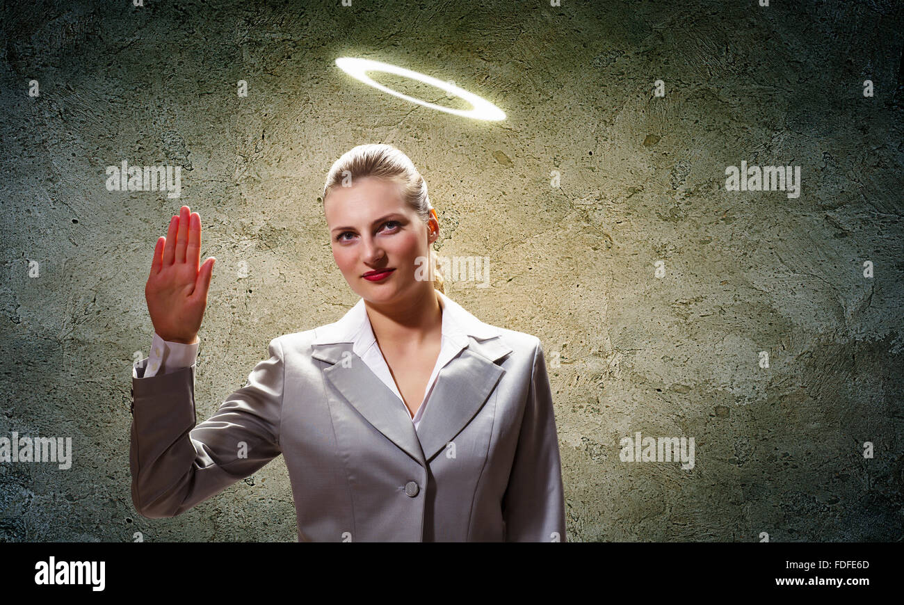 Image of businesswoman with halo above head Stock Photo - Alamy