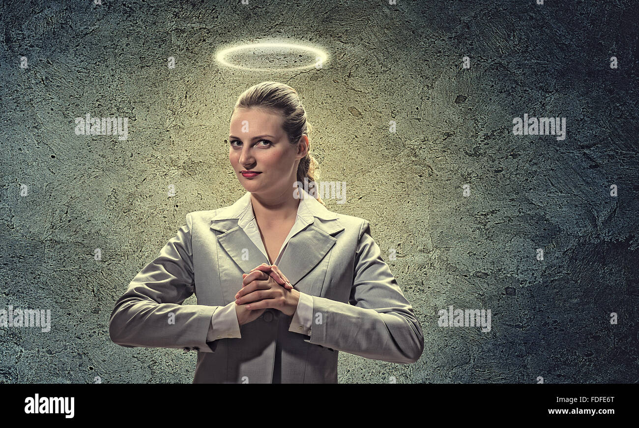 Image of businesswoman with halo above head Stock Photo - Alamy