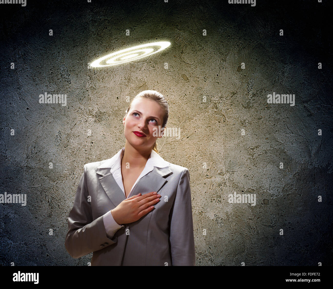 Image of businesswoman with halo above head Stock Photo - Alamy