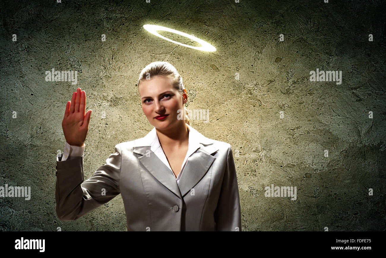 Image of businesswoman with halo above head Stock Photo - Alamy