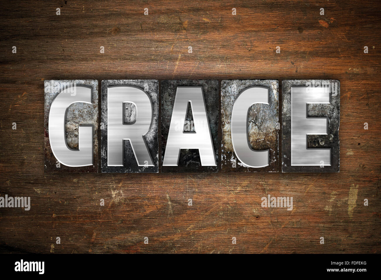The word "Grace" written in vintage metal letterpress type on an aged ...