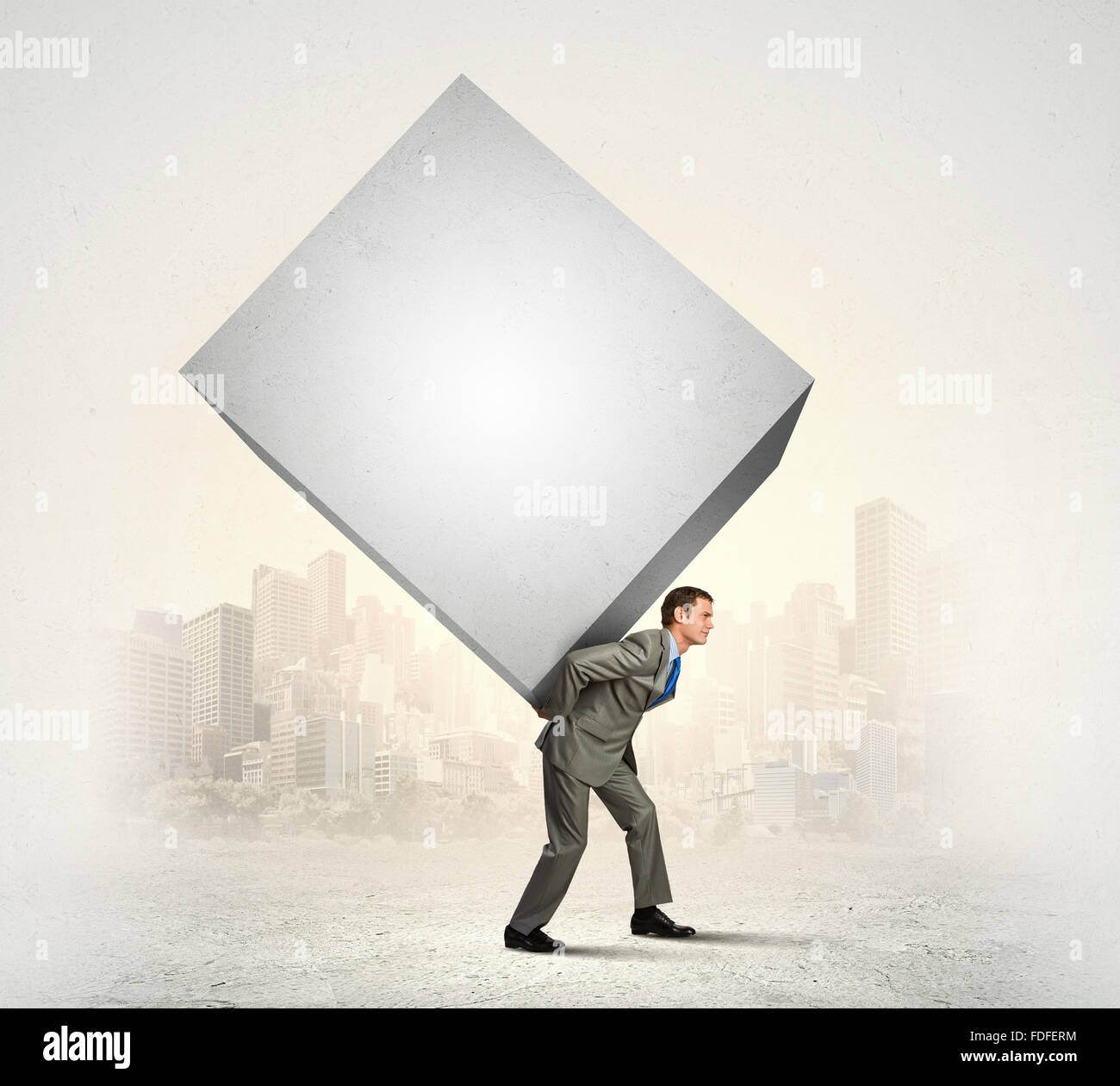 Image of businessman carrying big white cube on his back Stock Photo ...