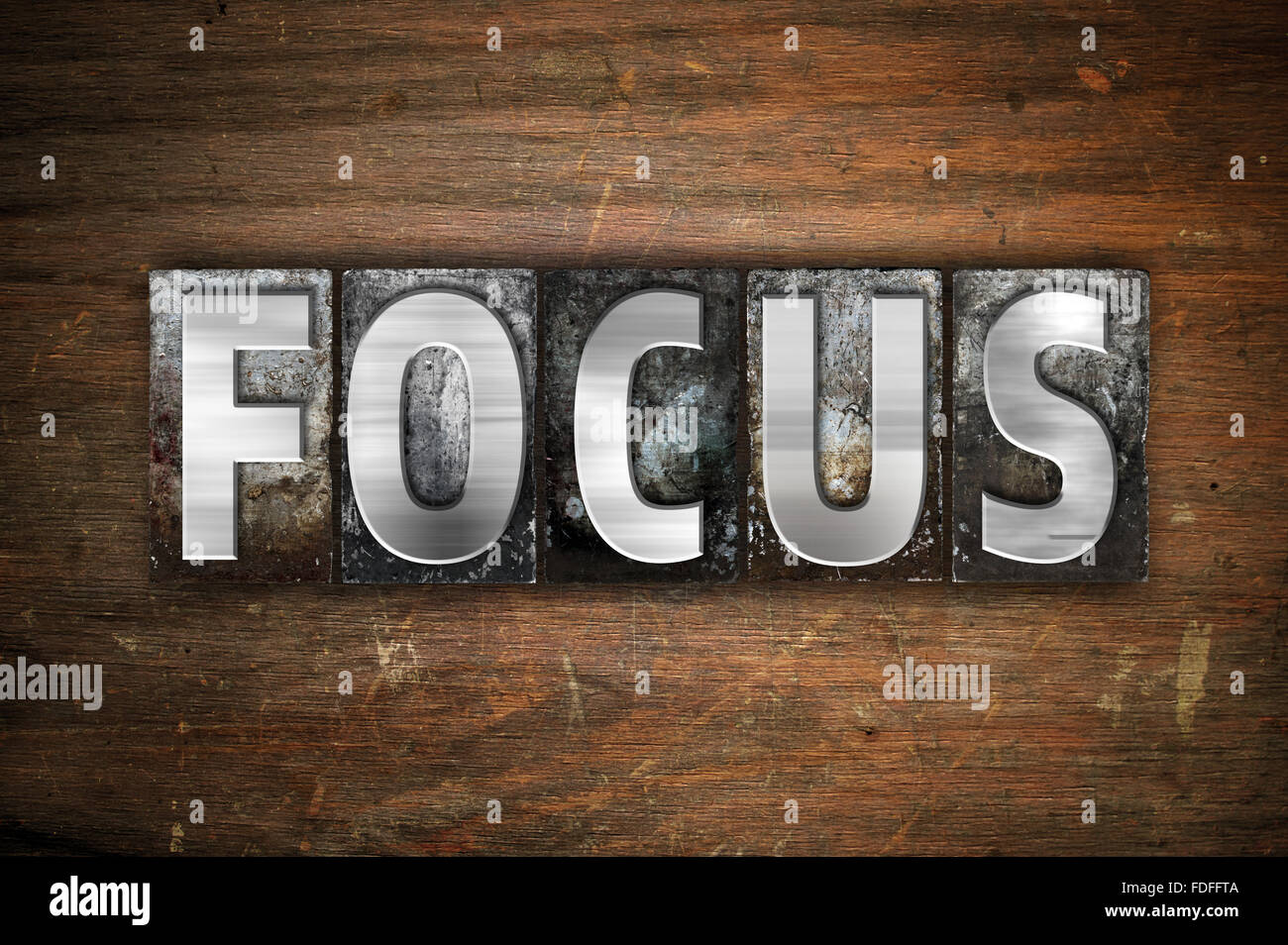 The word "Focus" written in vintage metal letterpress type on an aged ...