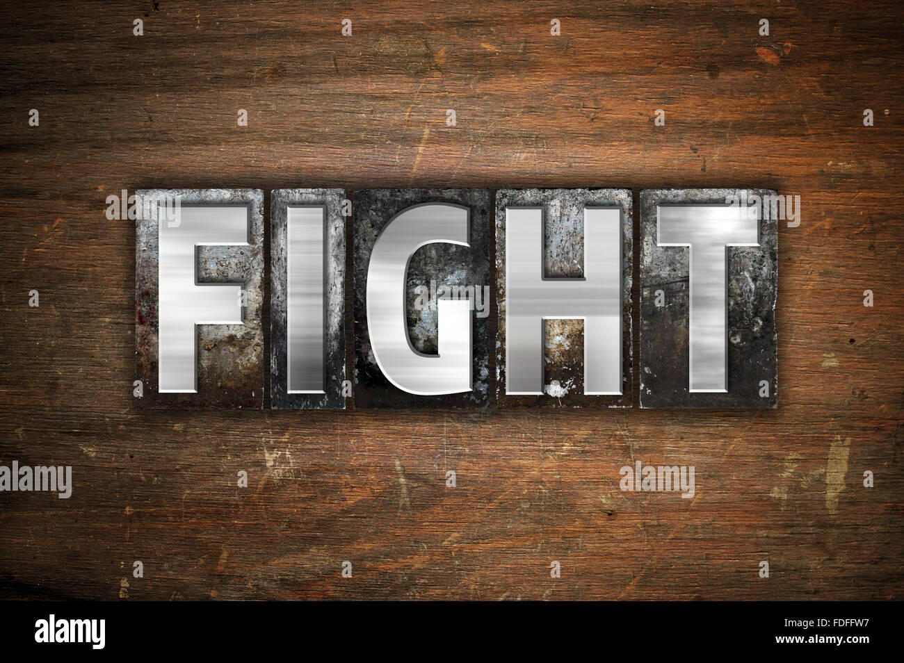 The word "Fight" written in vintage metal letterpress type on an aged ...