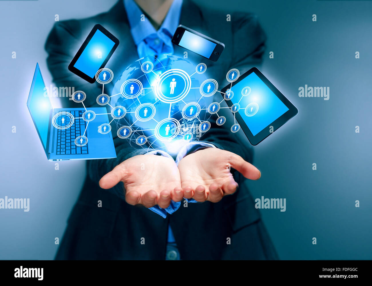 Image of business person holding devices in hands Stock Photo - Alamy