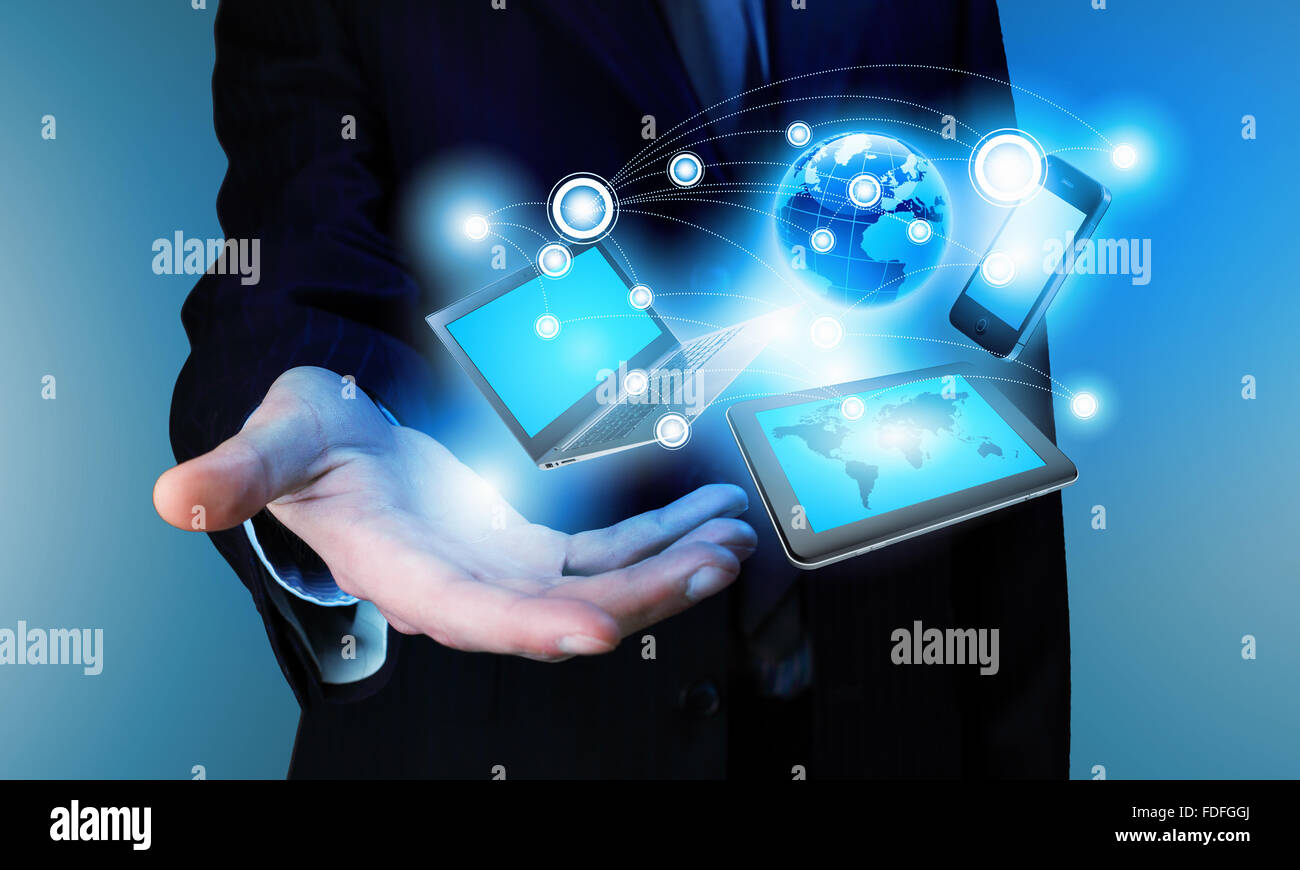 Image of business person holding devices in hands Stock Photo - Alamy