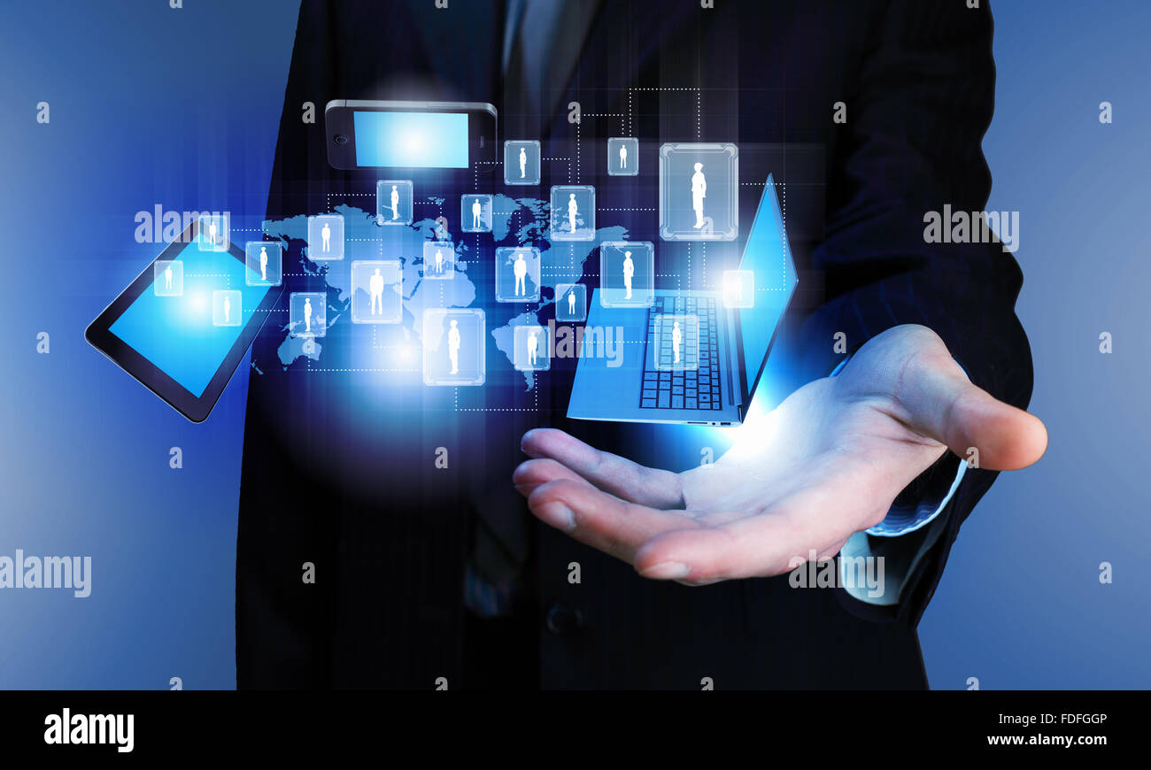 Image of business person holding devices in hands Stock Photo - Alamy