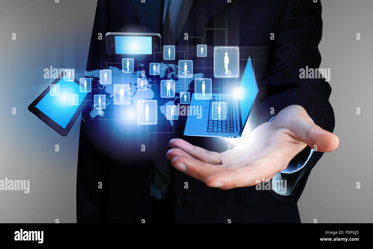 Image of business person holding devices in hands Stock Photo - Alamy