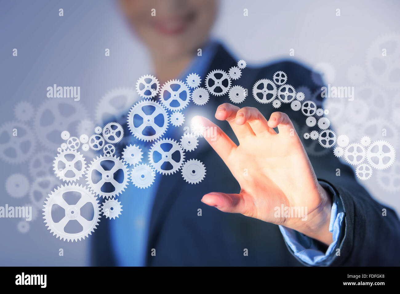 Image of businesswoman touching gear elements. Mechanism concept Stock ...