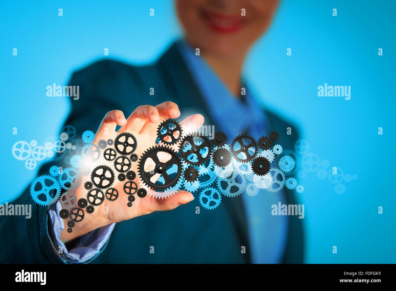 Image of businesswoman touching gear elements. Mechanism concept Stock ...