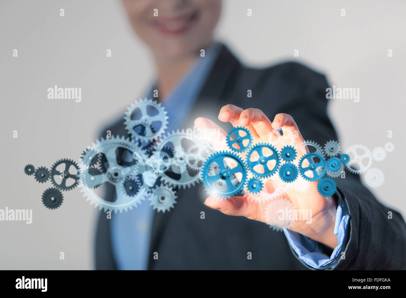 Image of businesswoman touching gear elements. Mechanism concept Stock ...