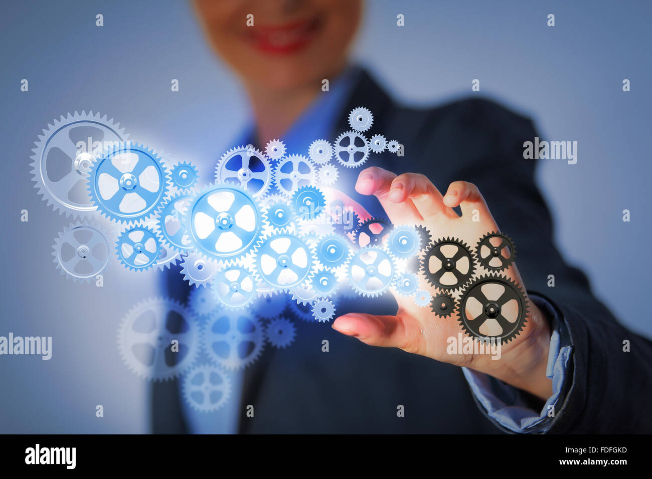 Image of businesswoman touching gear elements. Mechanism concept Stock ...