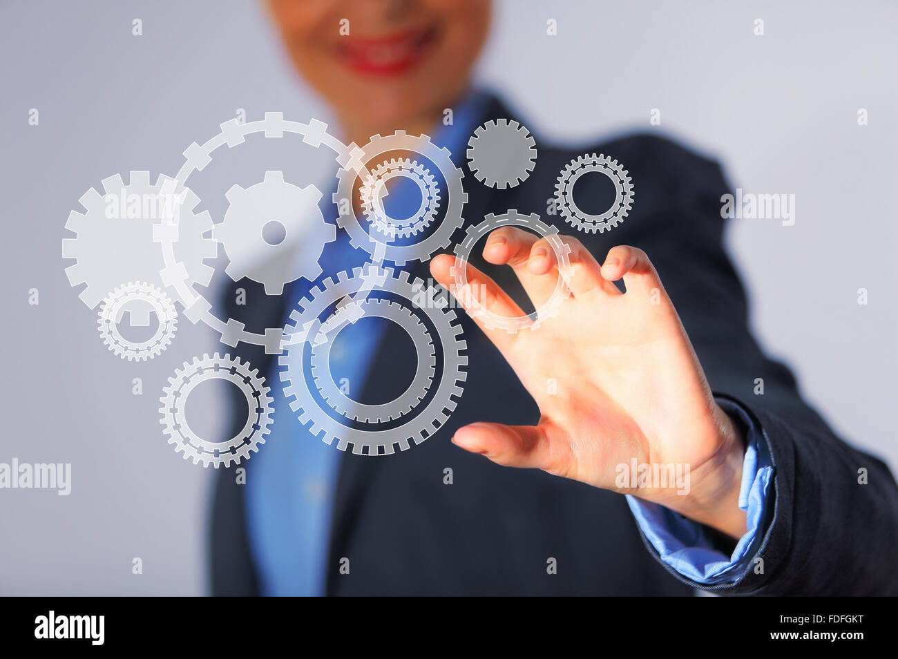 Image of businesswoman touching gear elements. Mechanism concept Stock ...