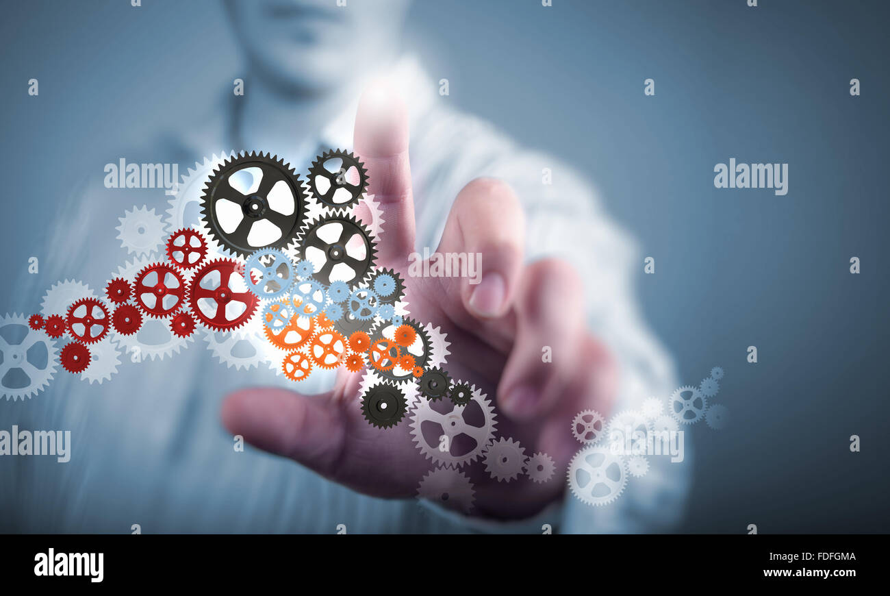 Image of businessman touching gear elements. Mechanism concept Stock ...